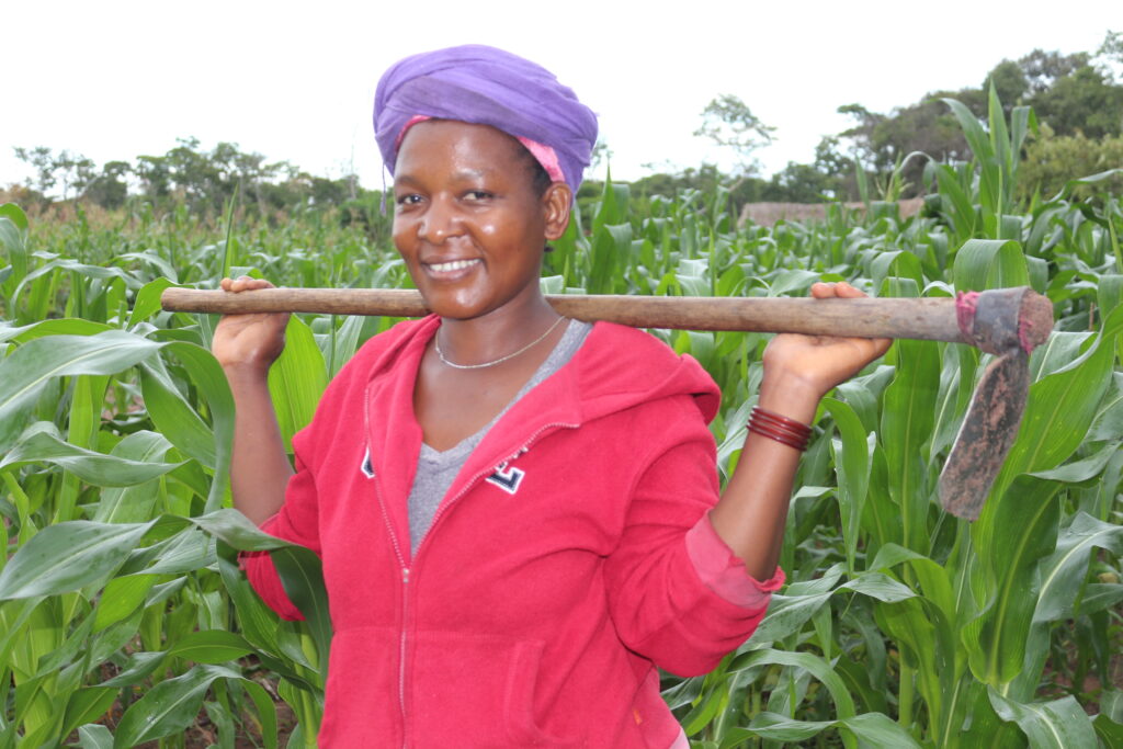 Vikonge_Mbuke.Luvinza.Holding.A.Hoe.On.Her.Shoulder_January 2022 ...